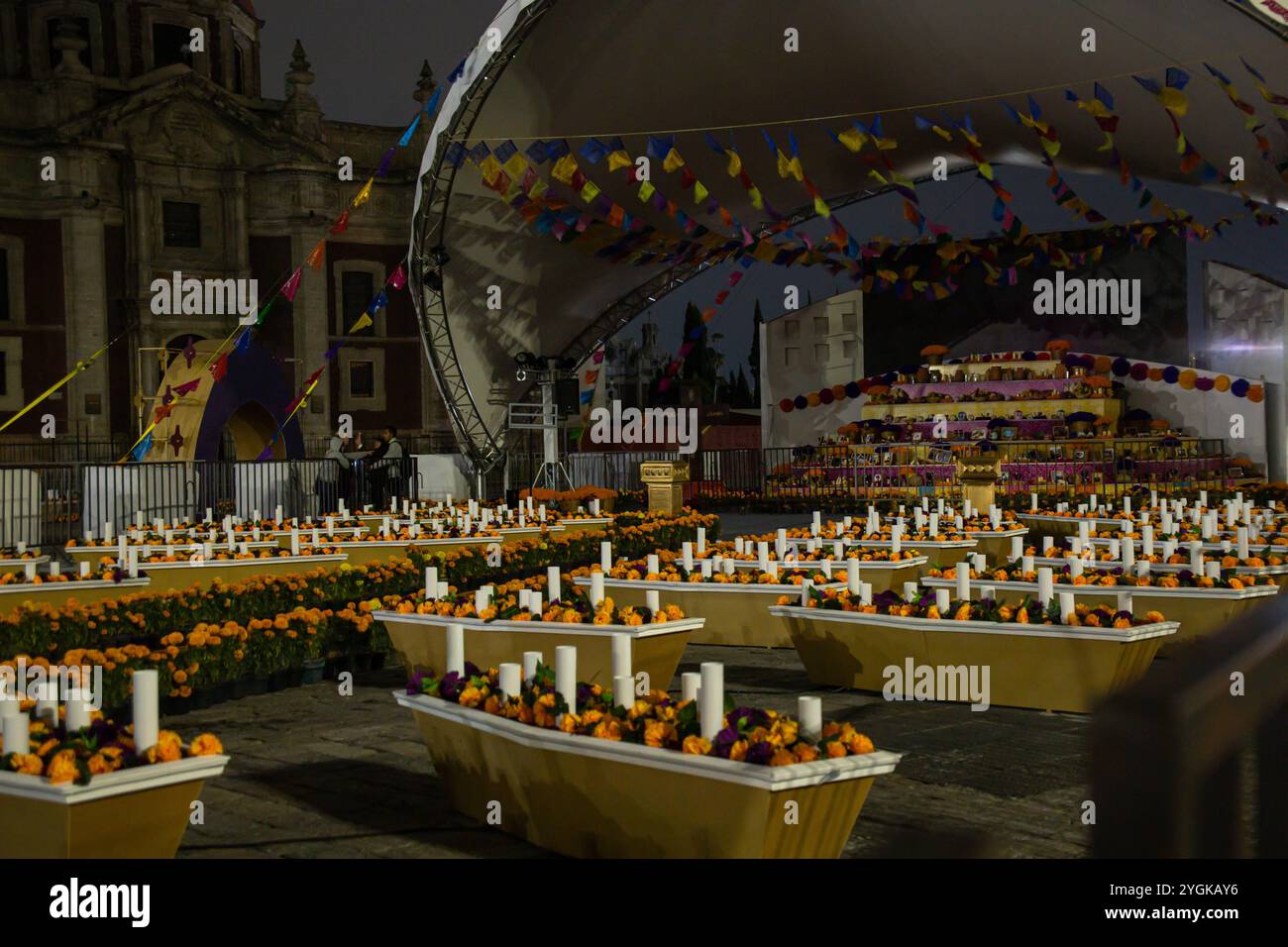 Day of the Dead altar adorned with marigolds, candles and food, set up ...
