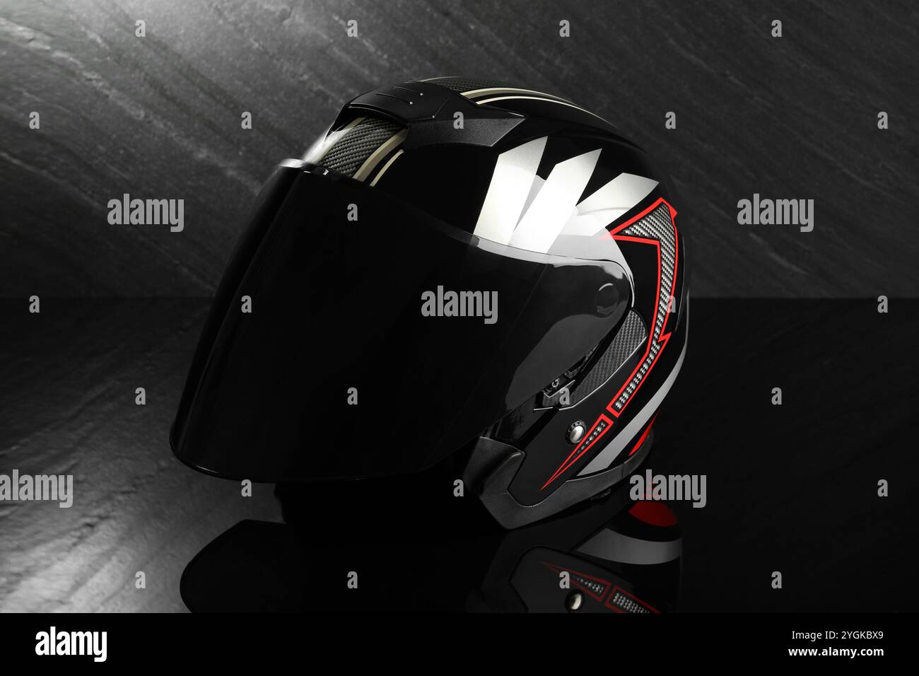 Modern motorcycle helmet with visor on dark gray background Stock Photo ...