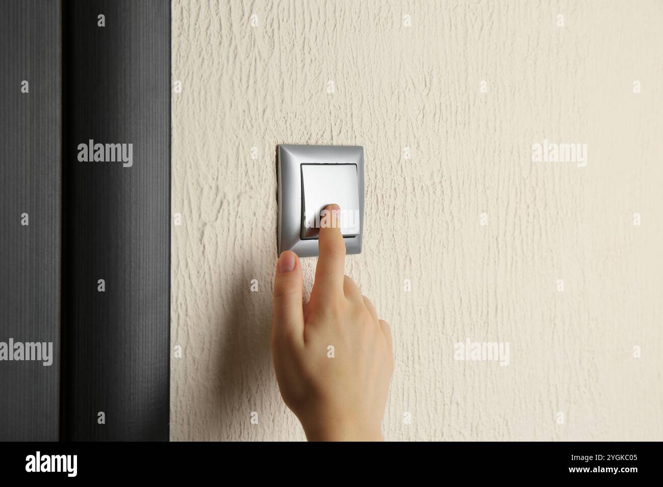 Woman turning light switch on, closeup view Stock Photo - Alamy