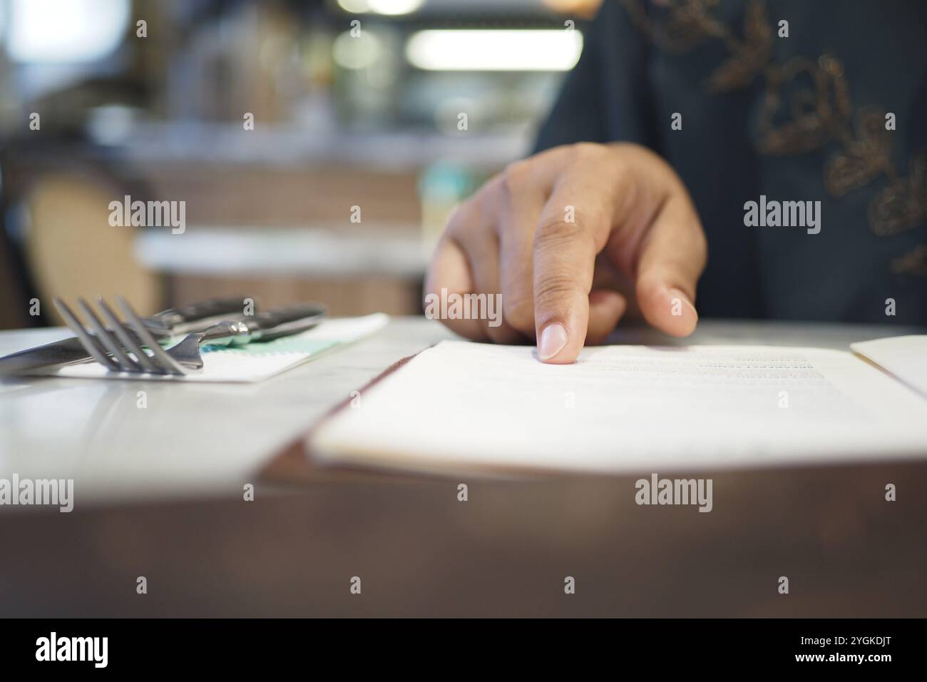women hand reading a food menu at cafe Stock Photo - Alamy