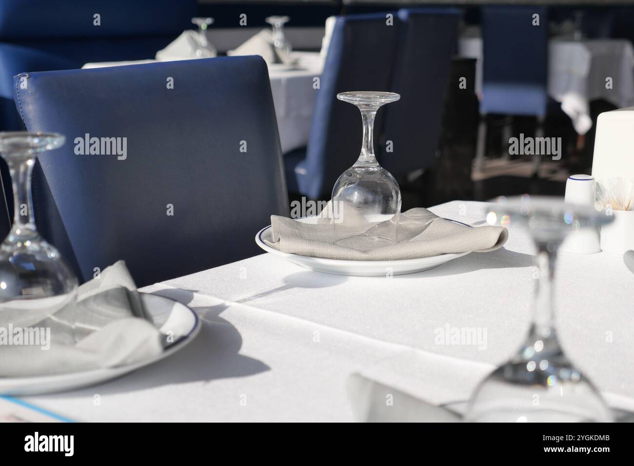 An Elegant Dining Setup featuring Beautiful Glasses and Plates for a ...