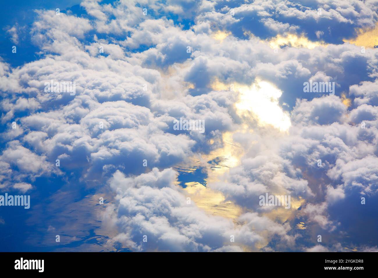 Expansive blue sky dotted with soft clouds, captured from the ...