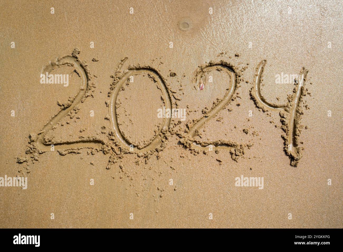 The Year 2024 Getting Written in Beautiful Sand at the Sunny Beachside ...