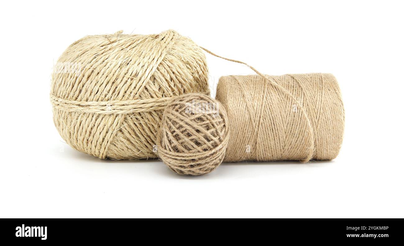 Different types of twine and string in natural colors. The largest is ...