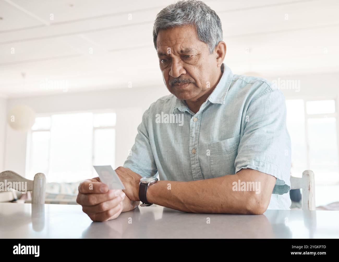 Thinking, photograph and sad with old man in kitchen for memory ...