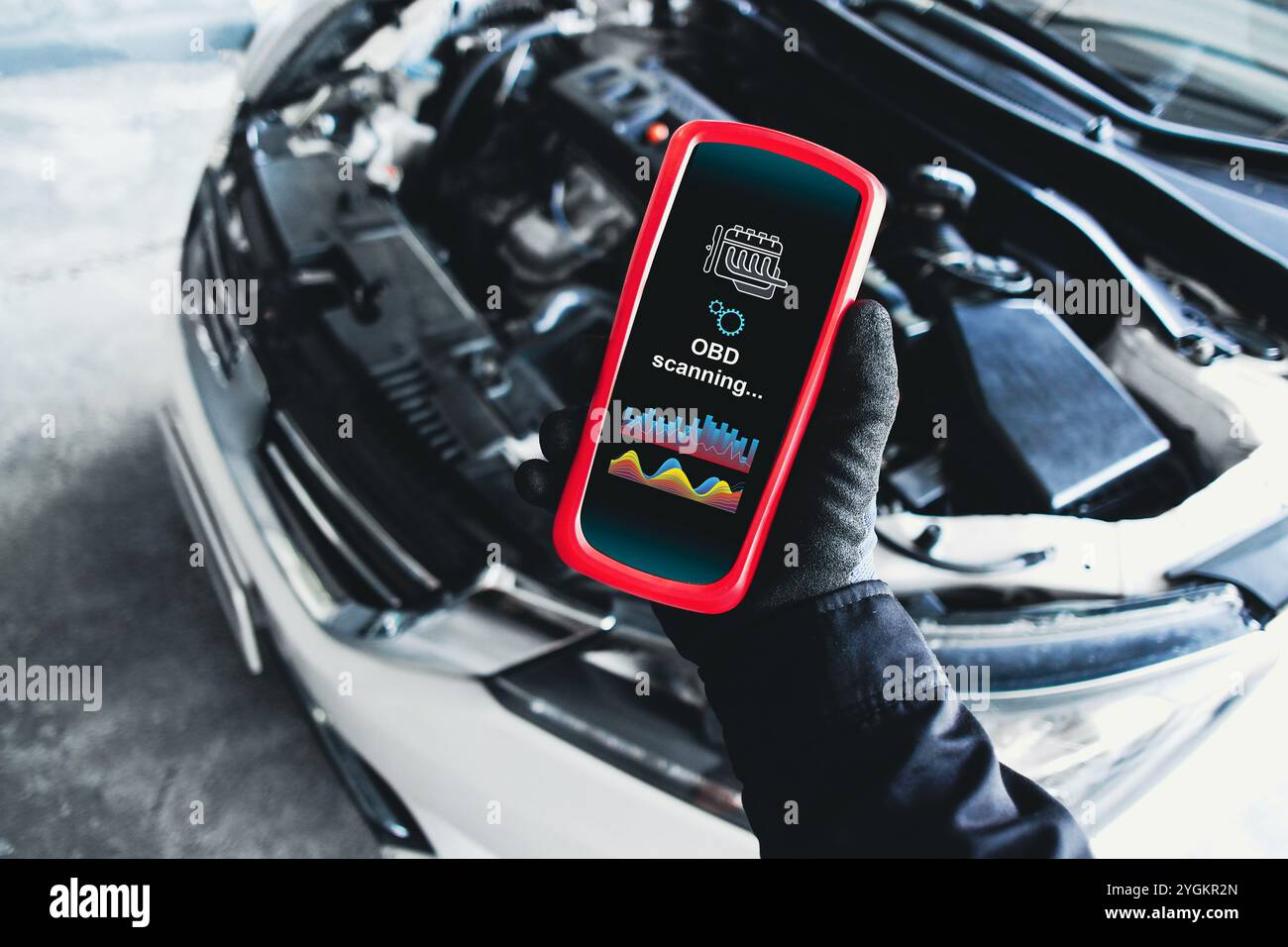 OBD scanner tools , OBD Scanner in use by mechanic over car engine ...