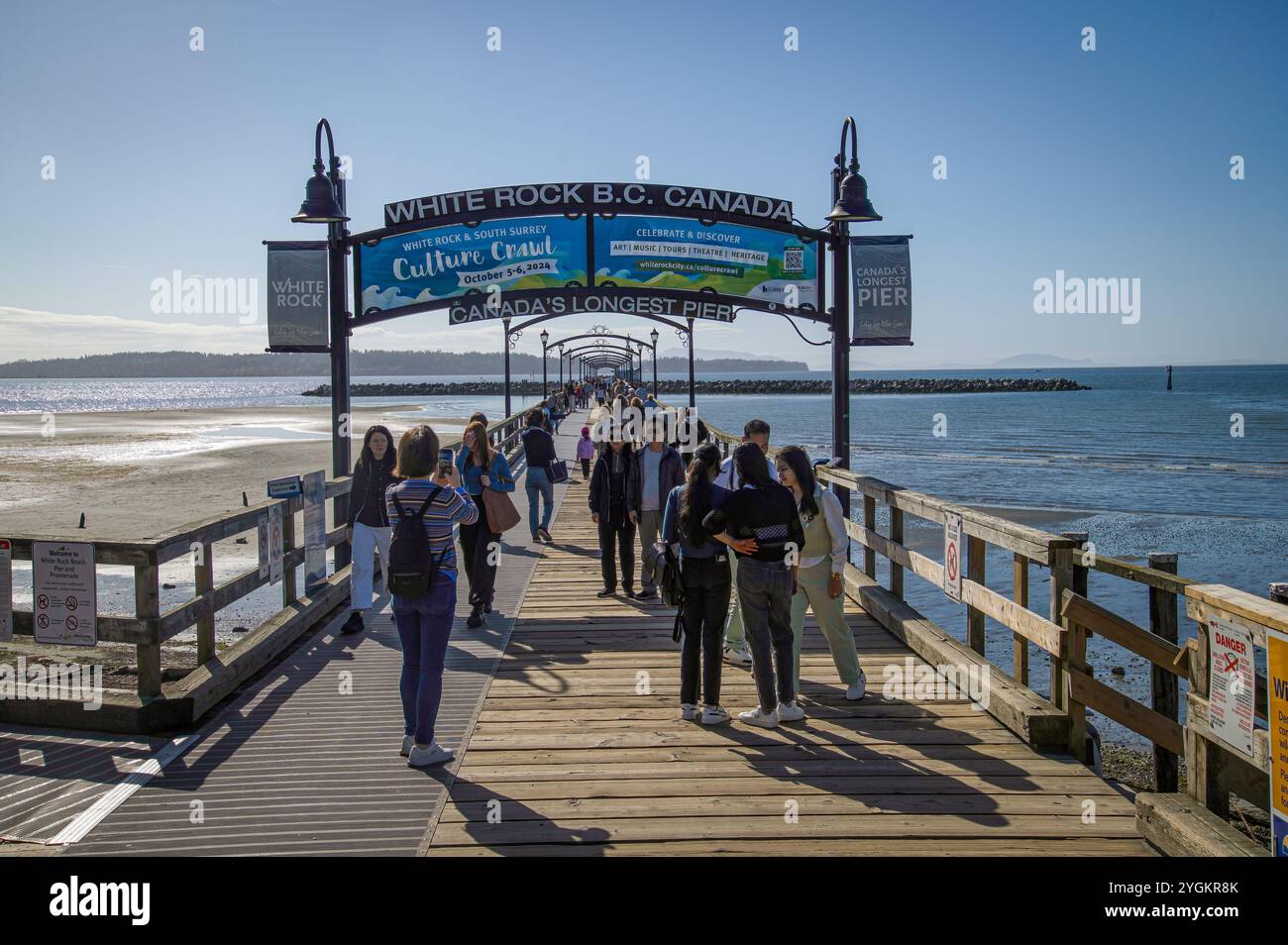 Photo of people visiting the 470-metre, wooden White Rock pier ...