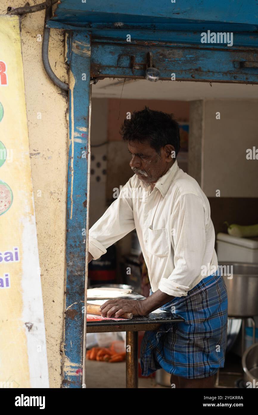 South indian man making chapati Stock Photo - Alamy