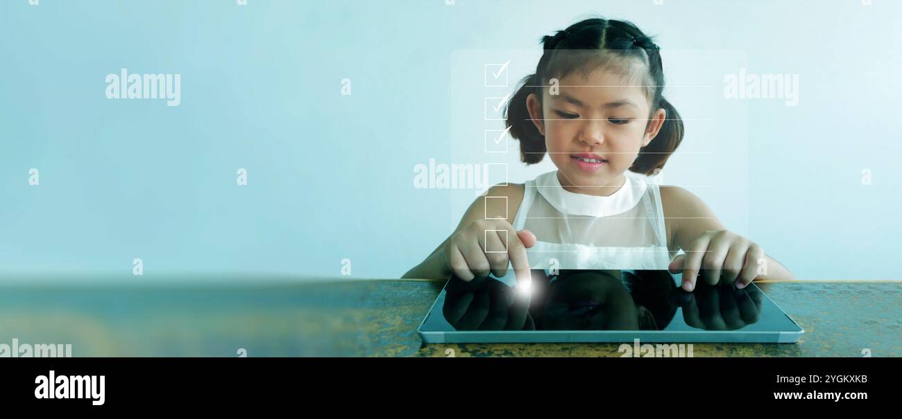 Checklist concept. Little girl tapping with a tablet checking digital ...