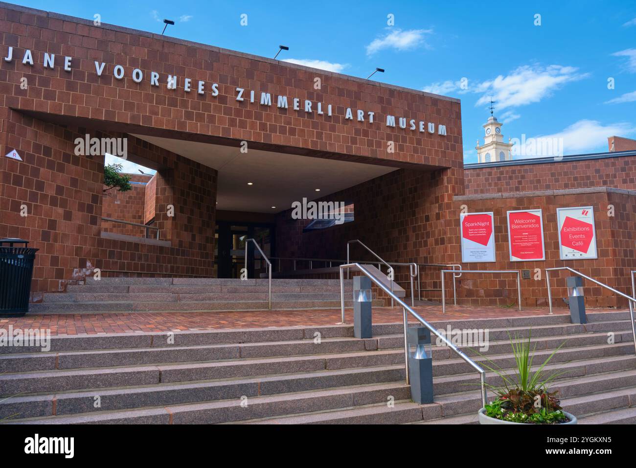 The front entrance, brown brick and steps leading inside. At the ...