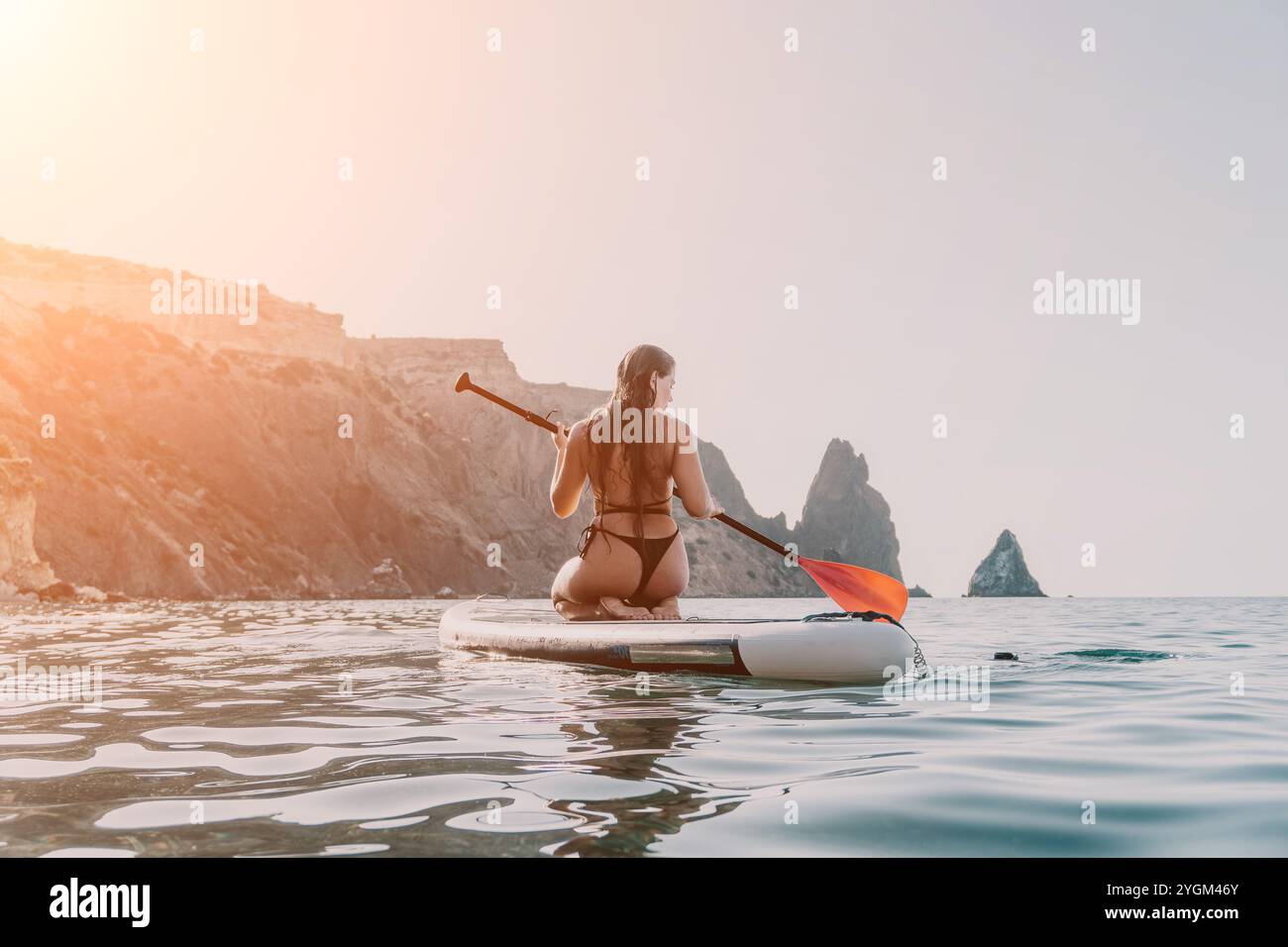 Woman Paddleboarding Ocean Cliffs Summer Adventure Stock Photo - Alamy