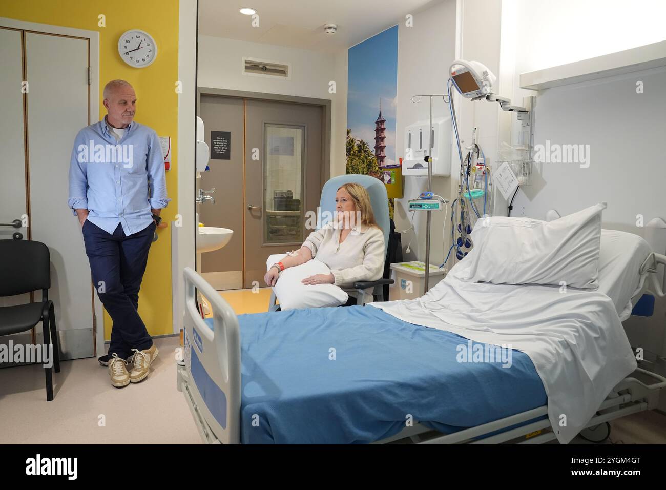 Patient Katie Tinkler talks with her husband Simon before she receives ...