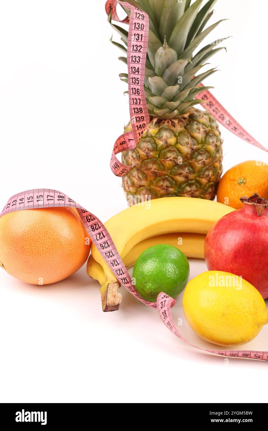 tape measure and fruits composition isolated on a white background ...