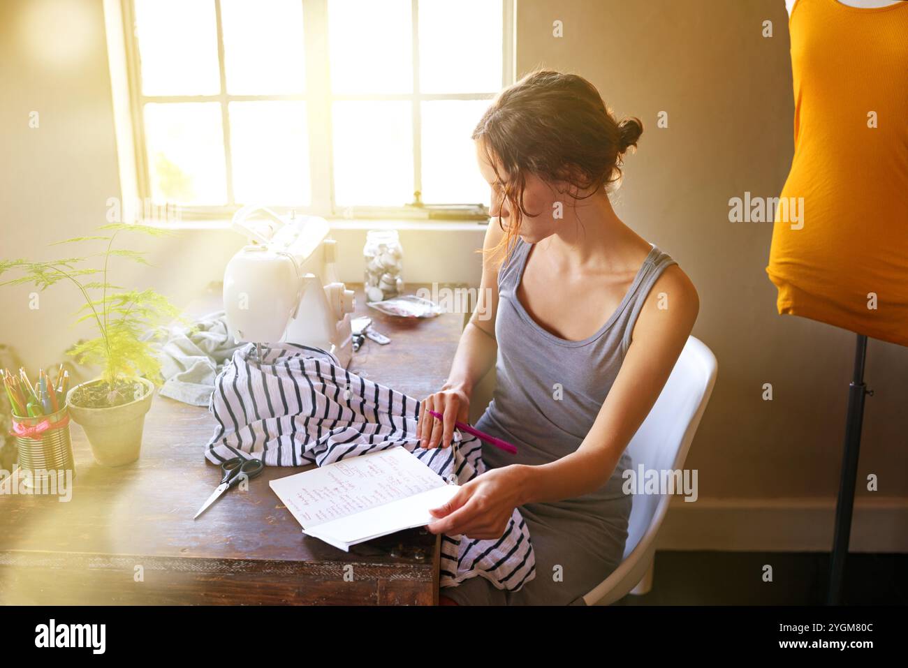 Business, woman and designer with notebook for fashion, clothes ...