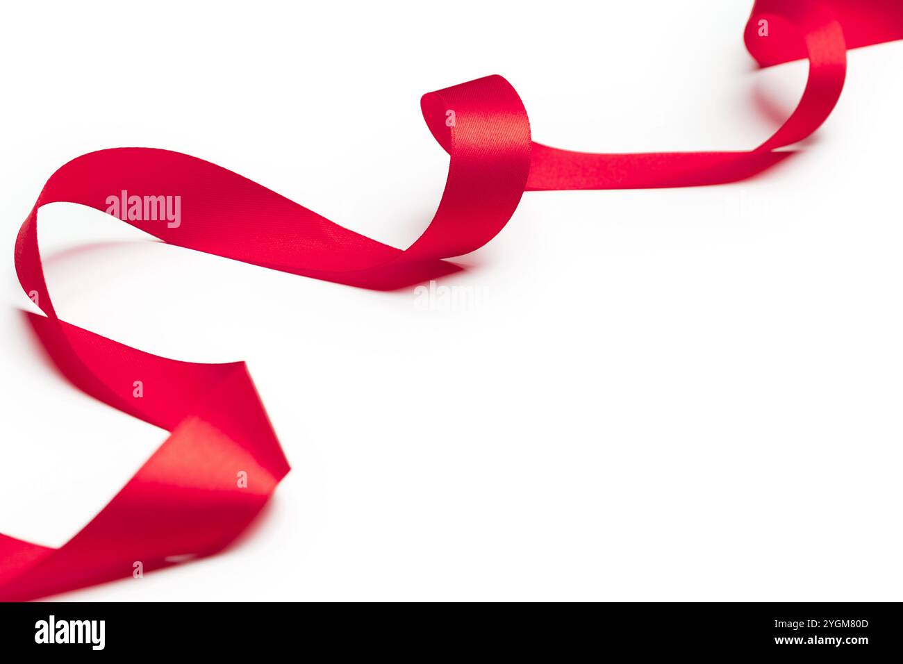 Red ribbon on white background Stock Photo - Alamy