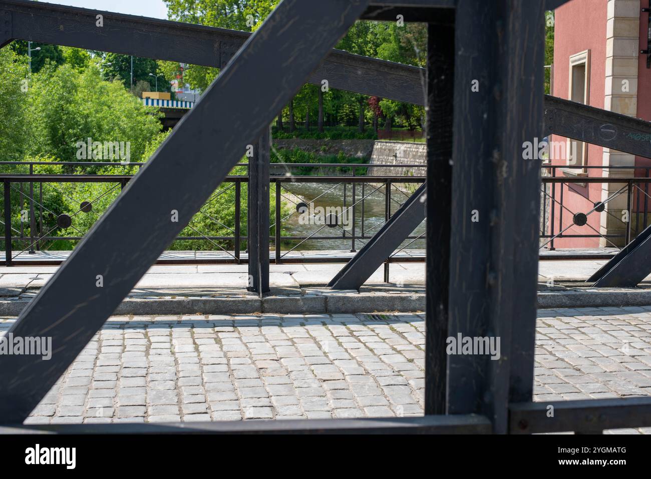 A bridge in Klodzko spanning the Nysa river, featuring elegant arches ...