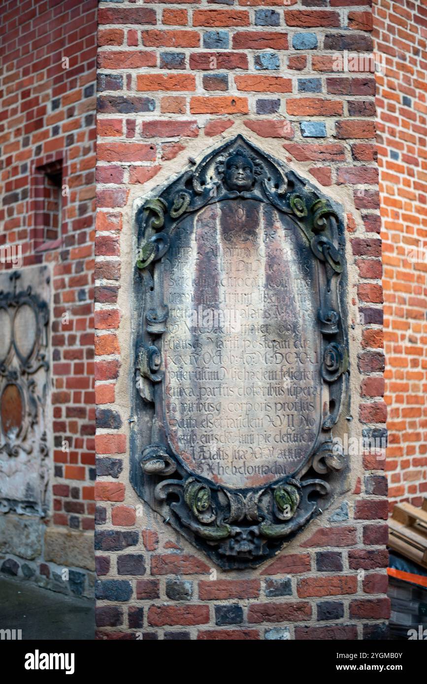 An ancient plaque mounted on a ceramic wall in Zabkowice, Poland ...