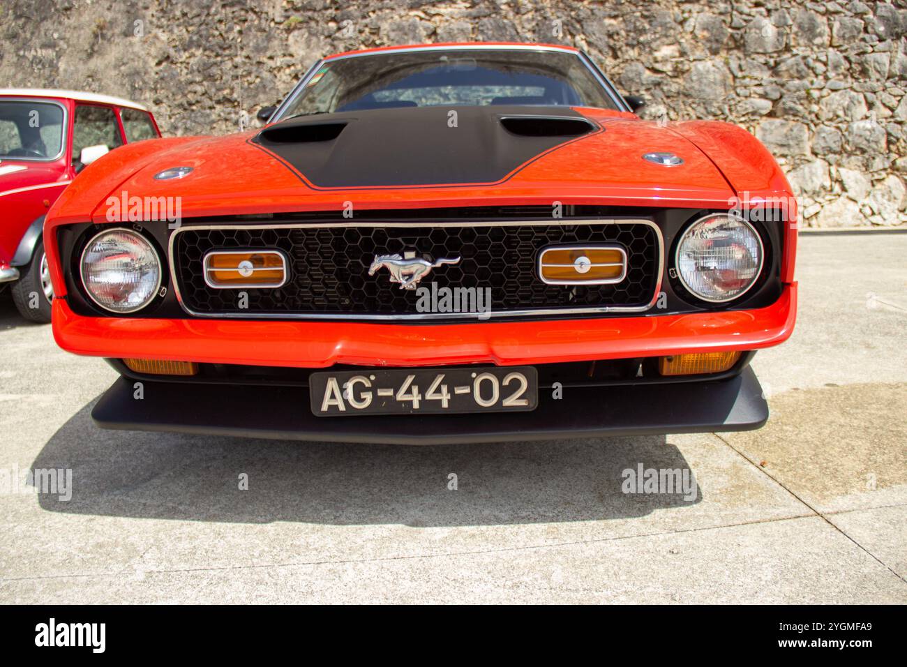 Powerful red ford mustang mach 1 parked, showing its impressive grille ...