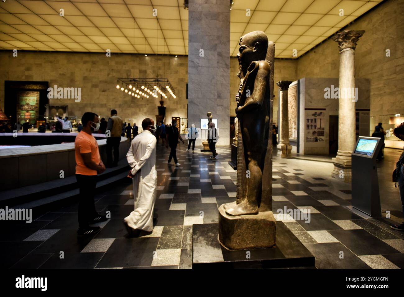 Cairo, Egypt. 4 April 2021. Visitors view the artefacts displayed in ...