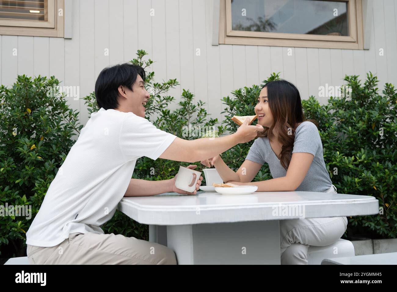 Loving family sharing breakfast hi-res stock photography and images - Alamy