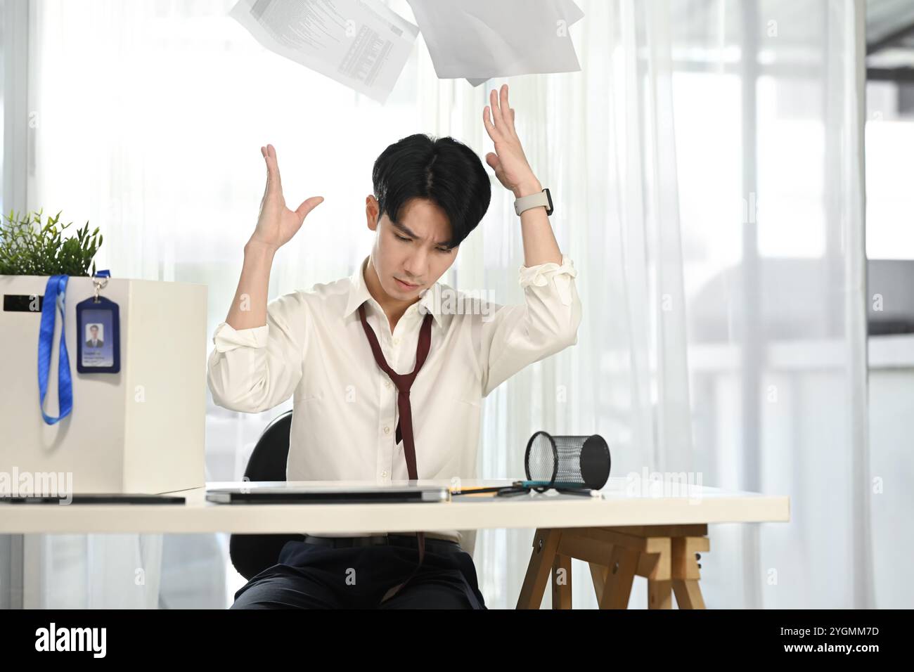 Frustrated office worker throwing documents in anger. Stress at work ...