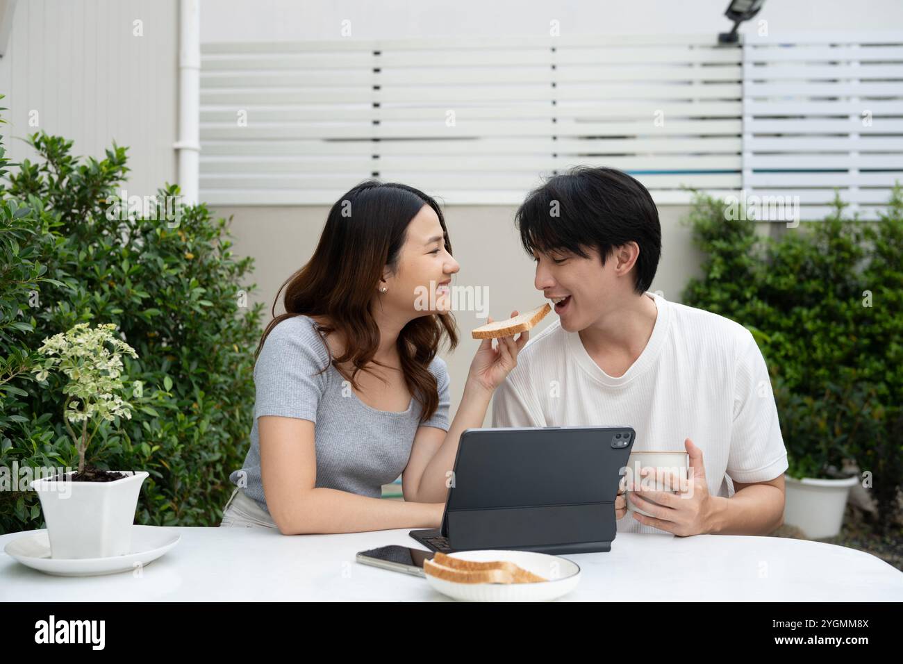 Loving family sharing breakfast hi-res stock photography and images - Alamy
