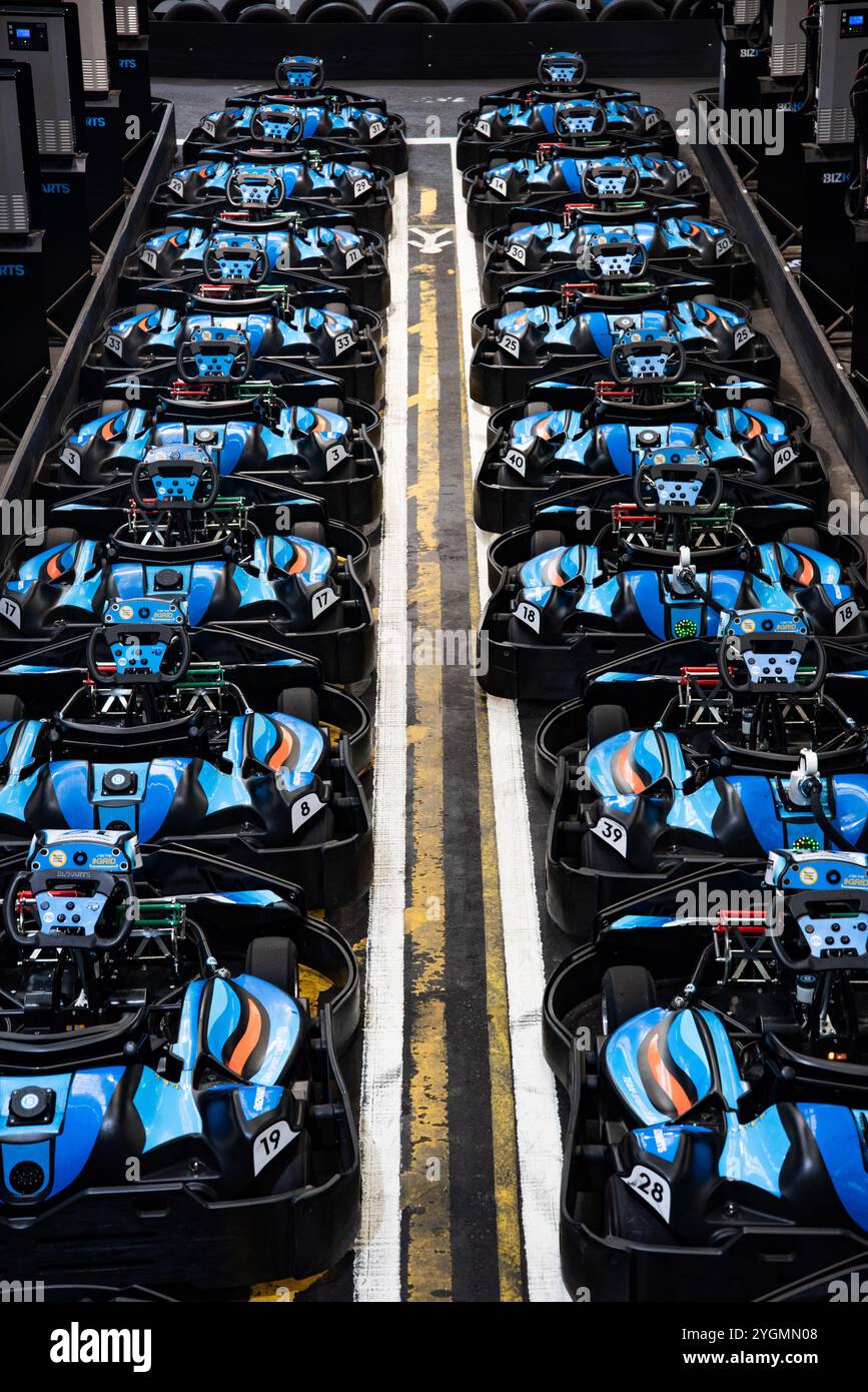 Electric Go karts lined up and charging at Team Sport indoor karting ...