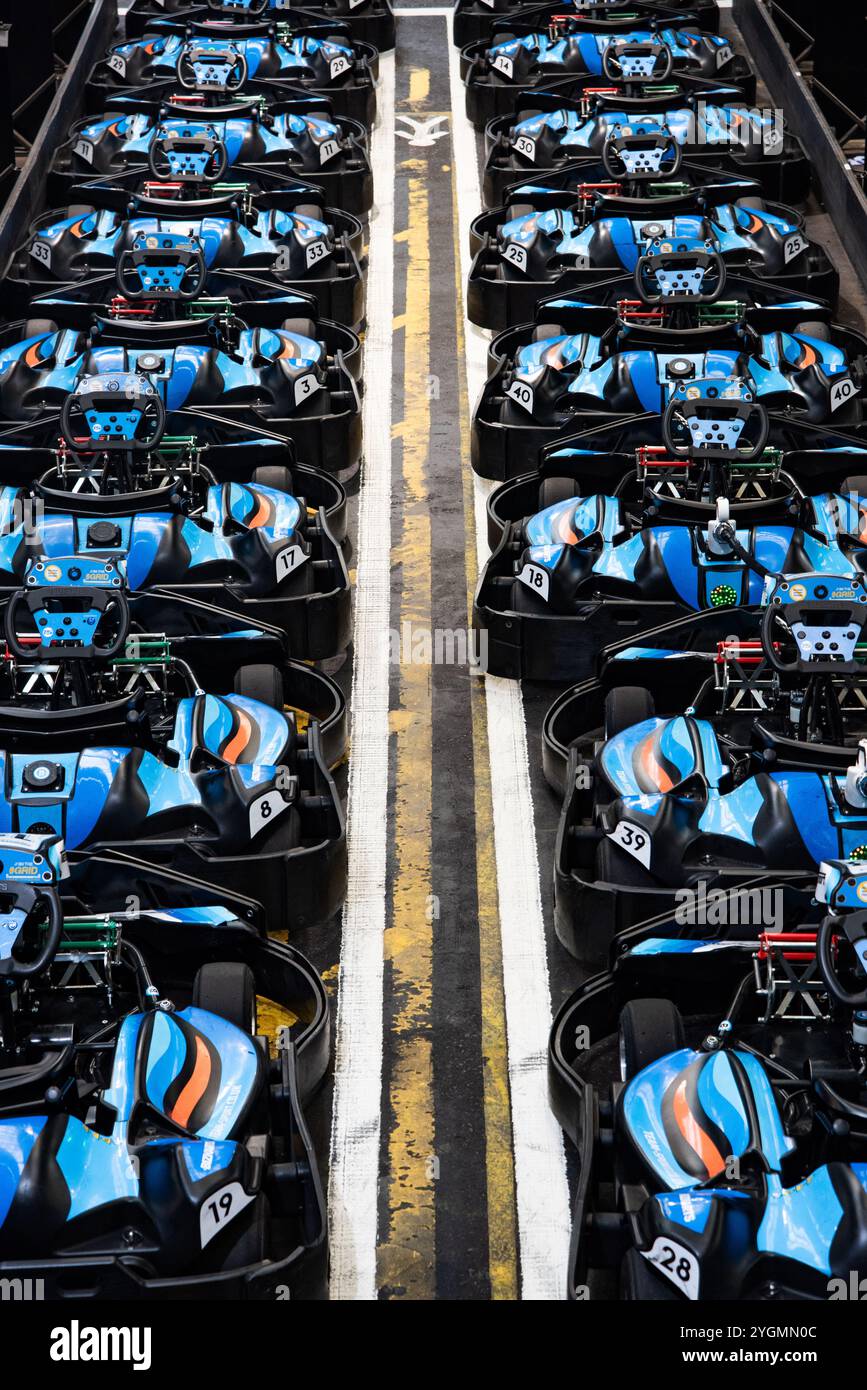 Electric Go karts lined up and charging at Team Sport indoor karting ...
