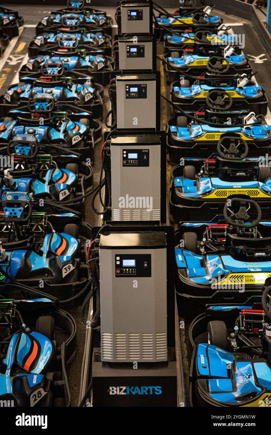Electric Go karts lined up and charging at Team Sport indoor karting ...