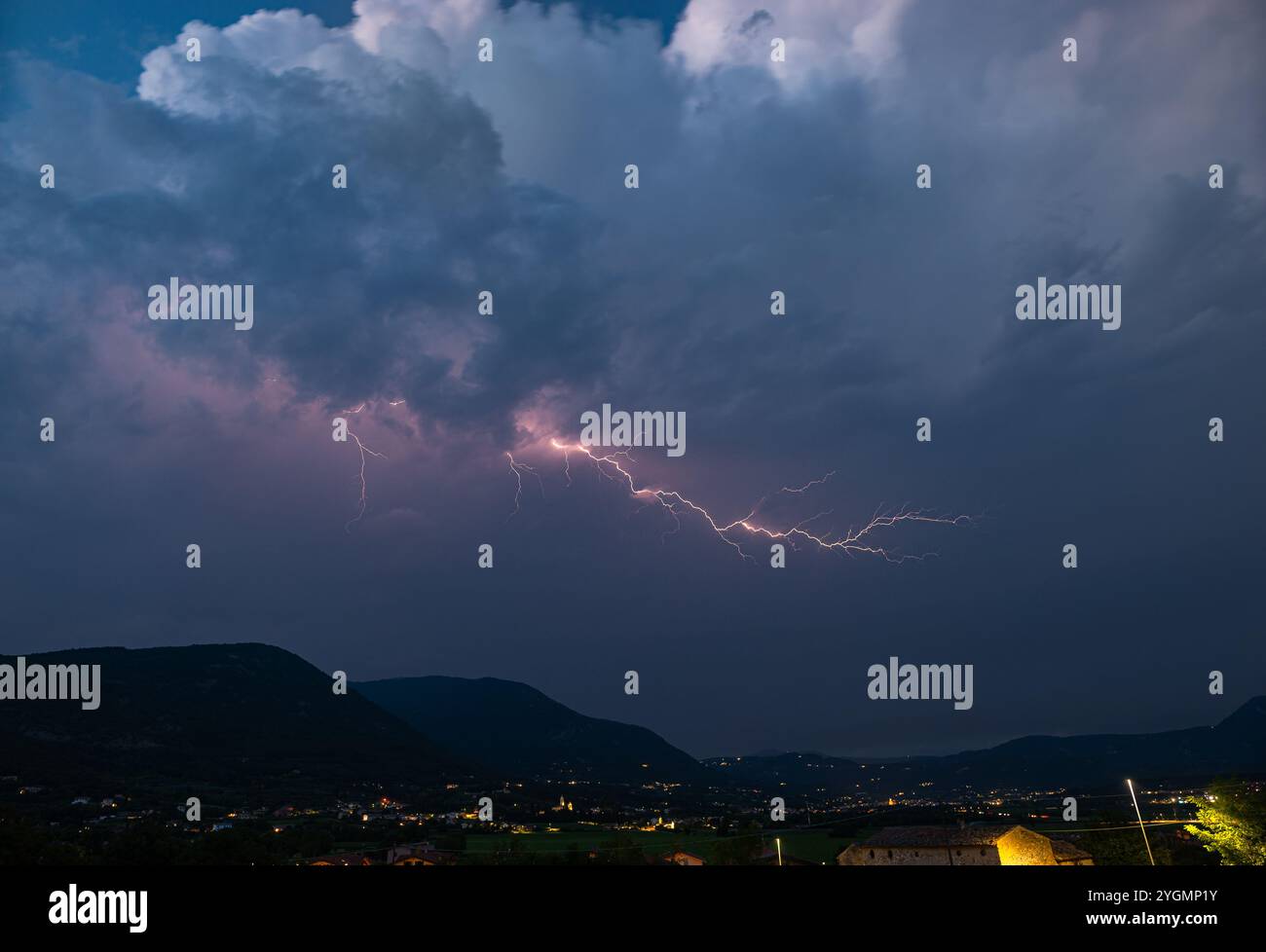Lightning discharge with side branches high in the sky above the ...