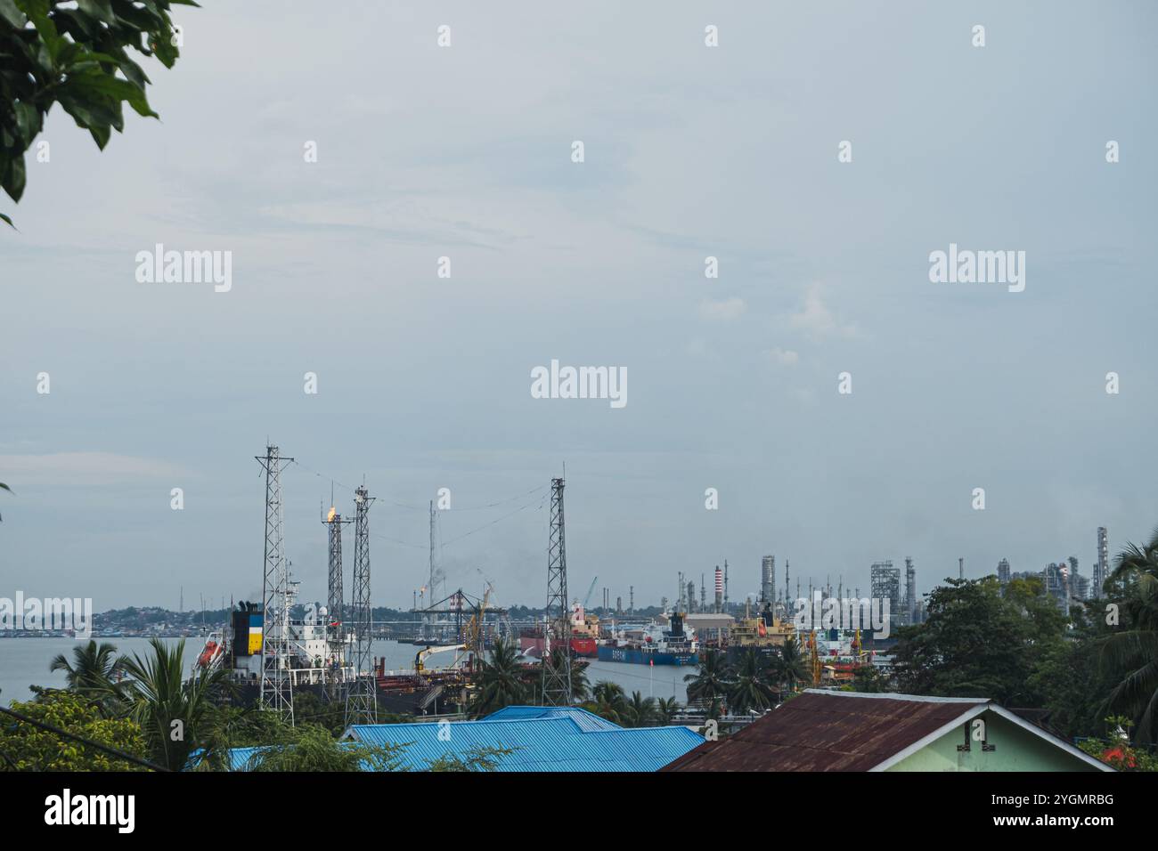 Photo of an oil refinery in Balikpapan city seen from above a housing ...