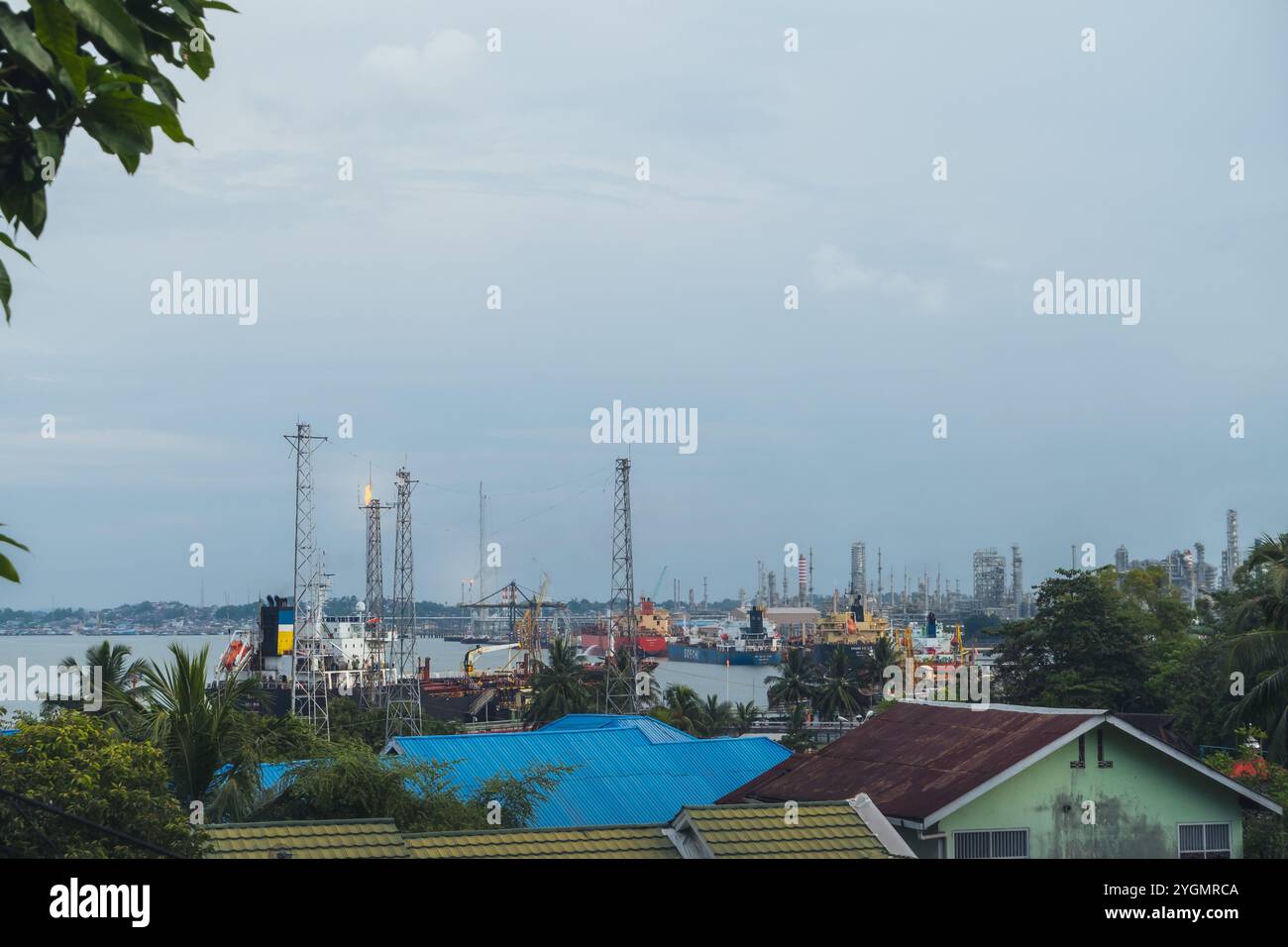 Photo of an oil refinery in Balikpapan city seen from above a housing ...