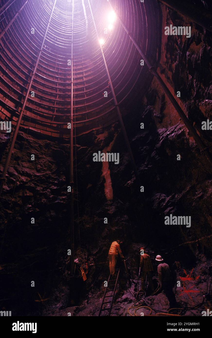 Workers climb up a water shaft being built in Brooklyn, New York Stock ...