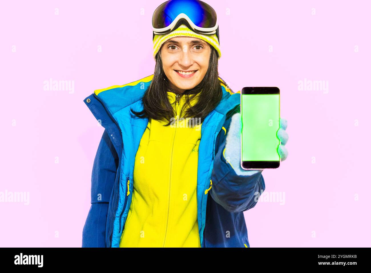 Skier young woman wear padded windbreaker jacket hat ski goggles mask ...