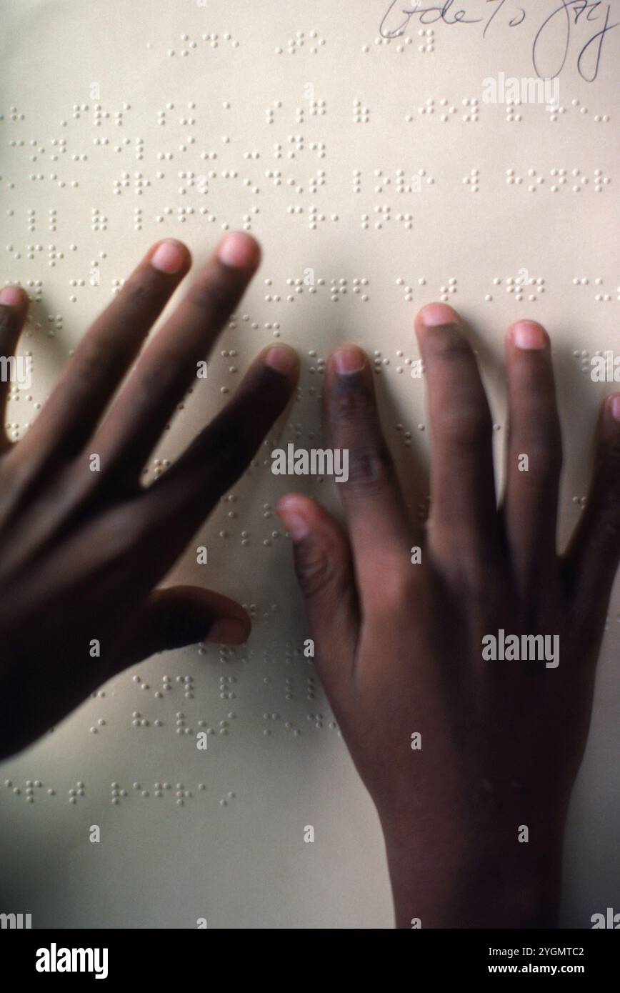 Blind person reading braille music Stock Photo - Alamy