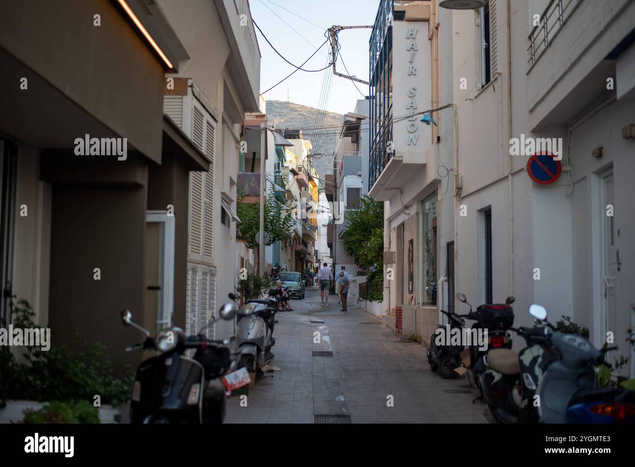 Narrow Greek streets in Hersonissos, Crete, Greece, lined with charming ...