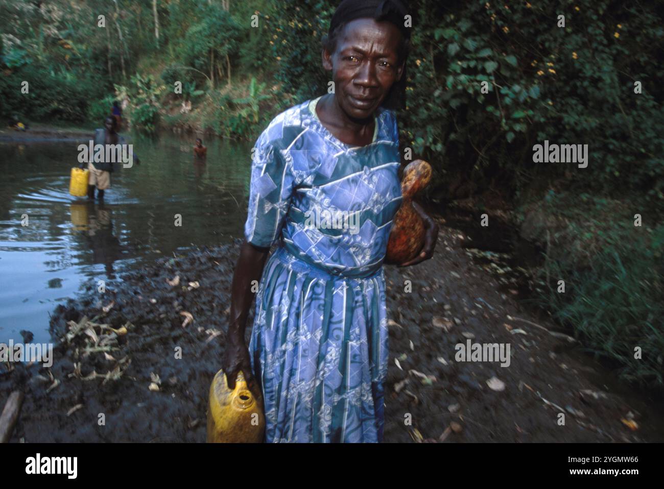 Collecting water from a small stream near Jinka, Ethiopia. This water ...