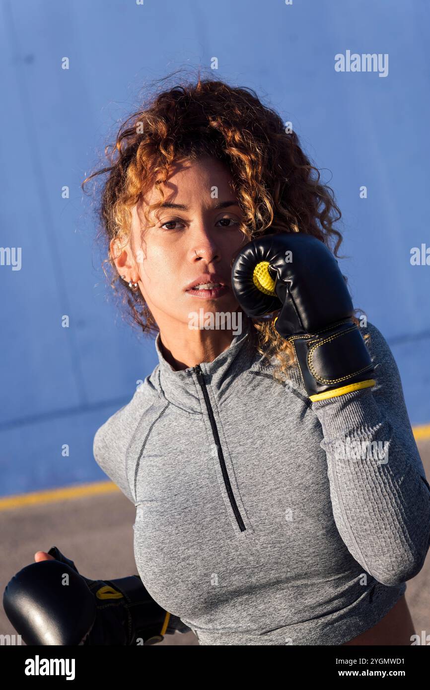 female boxer ready to workout with boxing gloves Stock Photo - Alamy