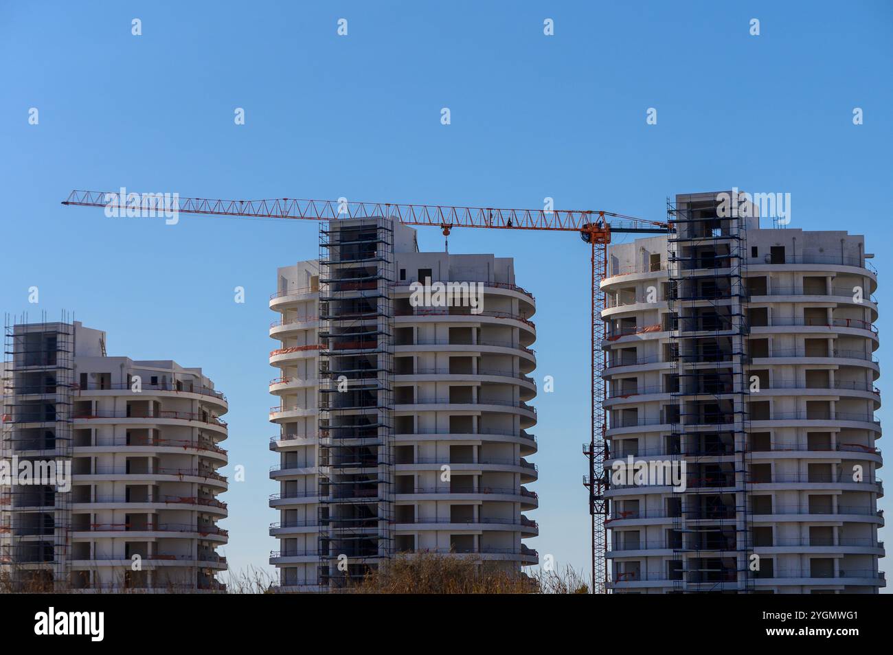 Construction workers against backdrop hi-res stock photography and ...