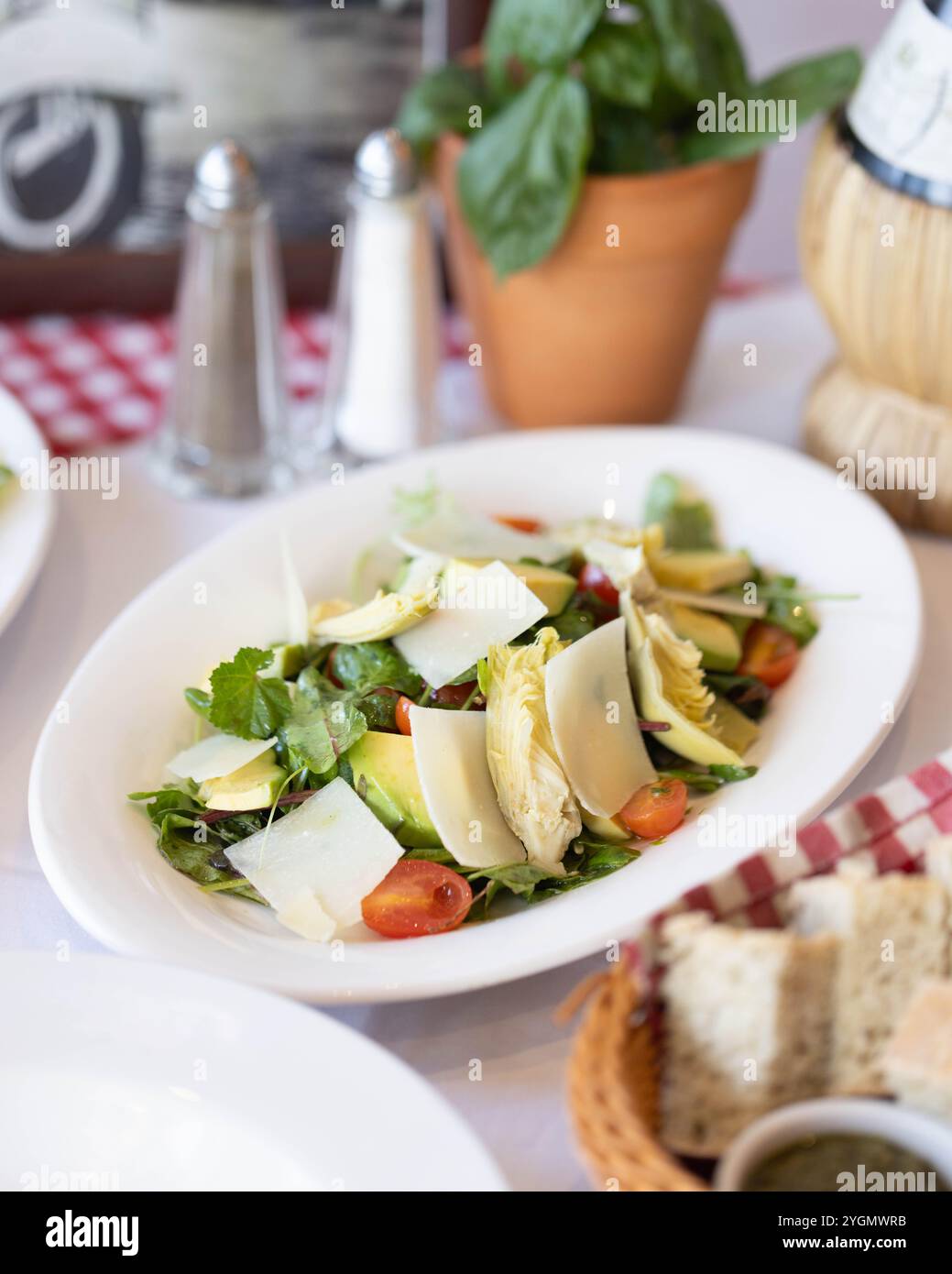 Italian salad setup in a restaurant on a table Stock Photo - Alamy
