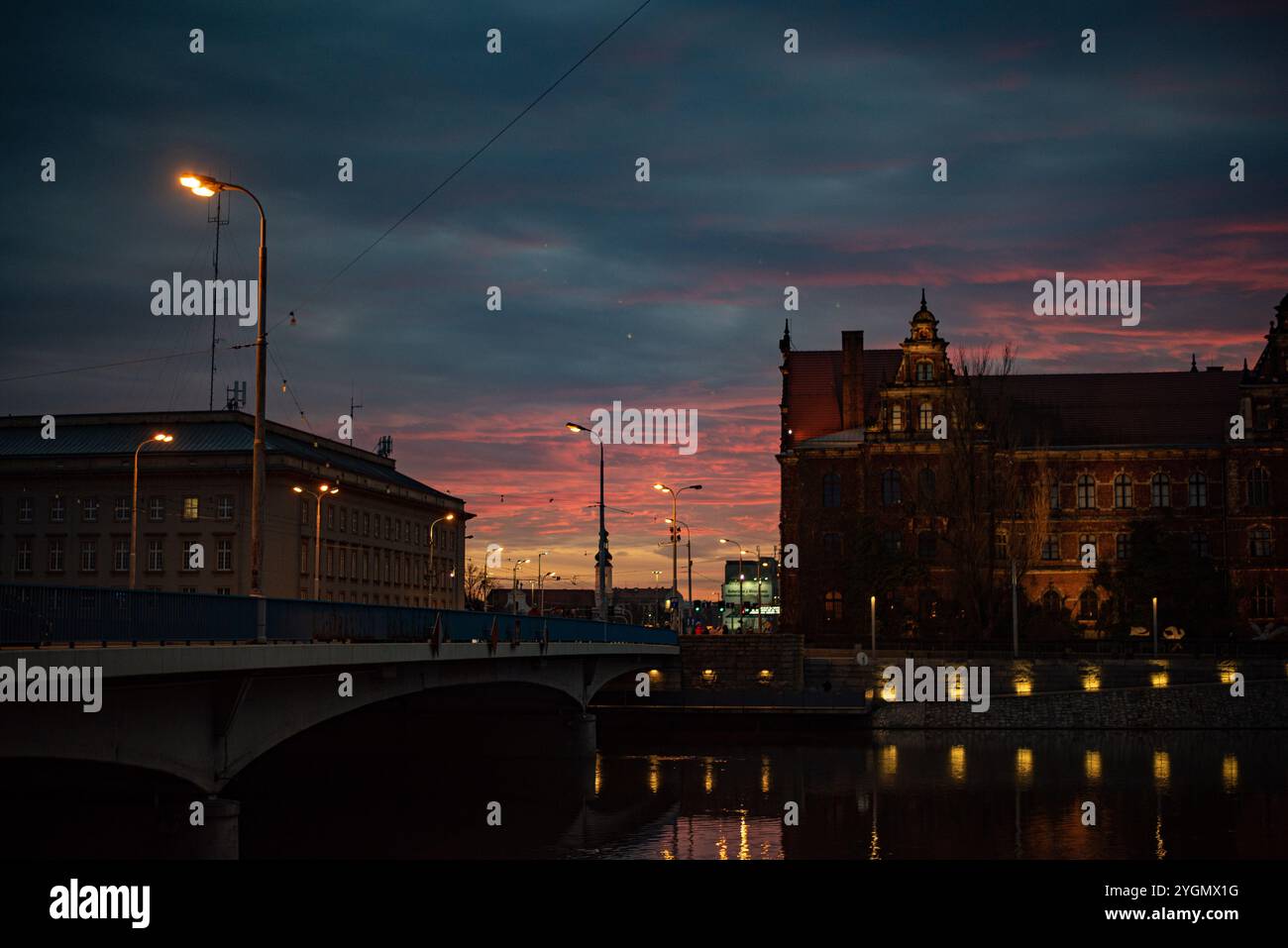 The incredible sunset sky above the National Museum in Wrocław casts a warm glow over the ...