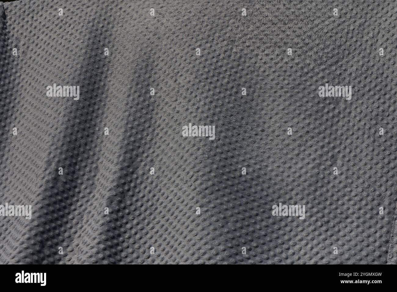 Light beautifully highlights the textures of the dark fabric ...