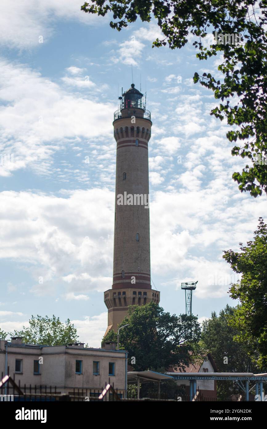 The lighthouse in Swinoujscie, Poland, stands tall against the backdrop ...