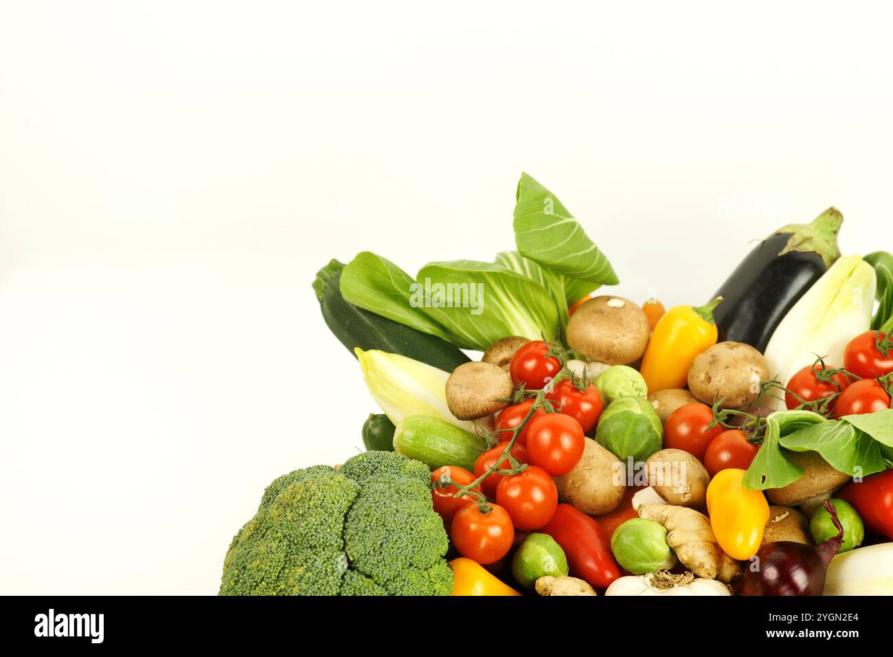 Raw mixed organic vegetables in the right bottom corner of the frame ...