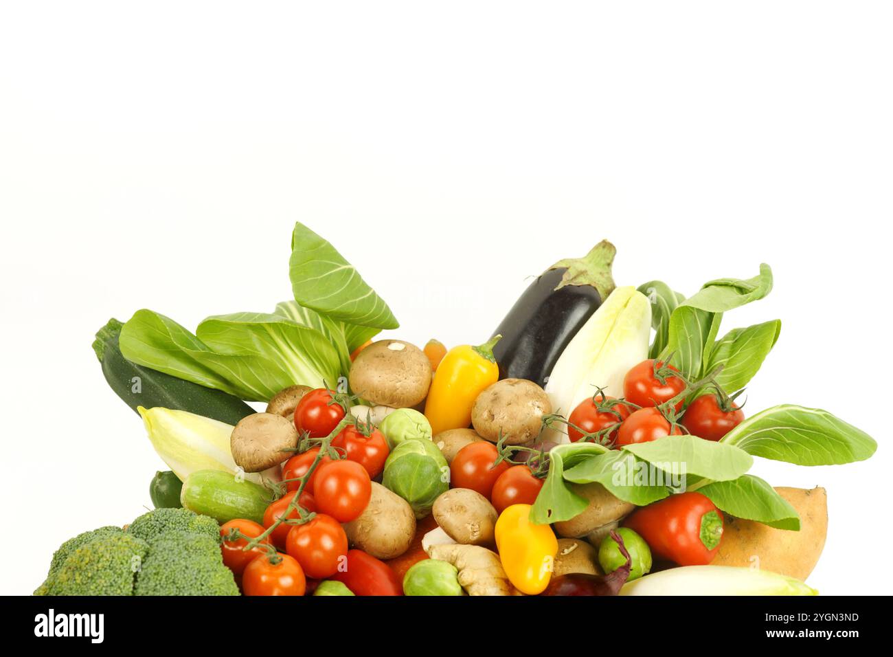 Raw mixed organic vegetables arranged at the bottom of the frame, on ...