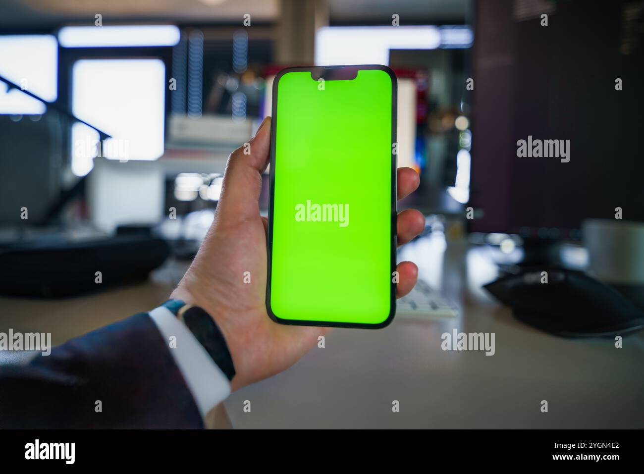 Hand showing smartphone green screen hi-res stock photography and ...