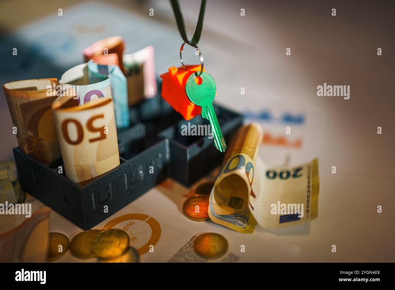 real estate market home door keys money charts documents on table ...