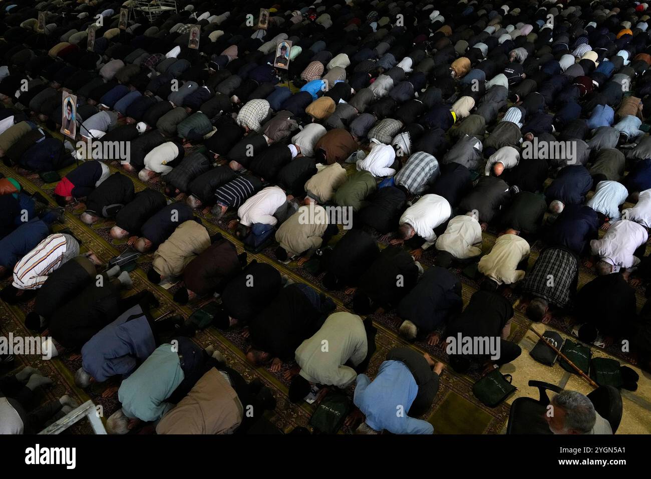 Iranian worshippers perform their Friday prayer at the Tehran ...