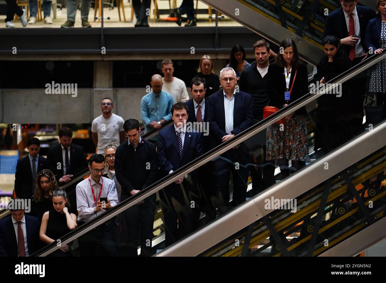 Staff line the atrium during the Lloyd's of London Armistice ...