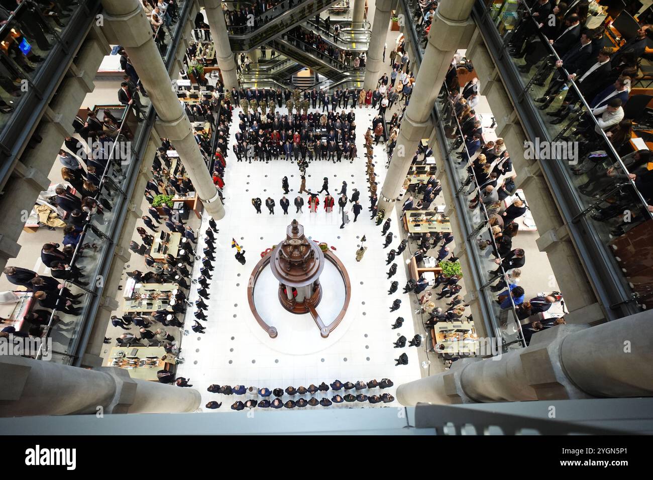 Staff line the atrium during the Lloyd's of London Armistice ...